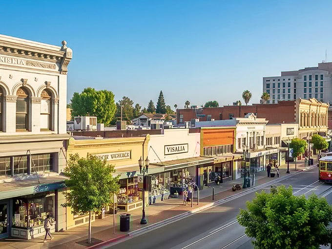 Visalia's downtown skyline basks in golden hour light, with the iconic Fox Theatre marquee standing proud like a sentinel of simpler times. 
