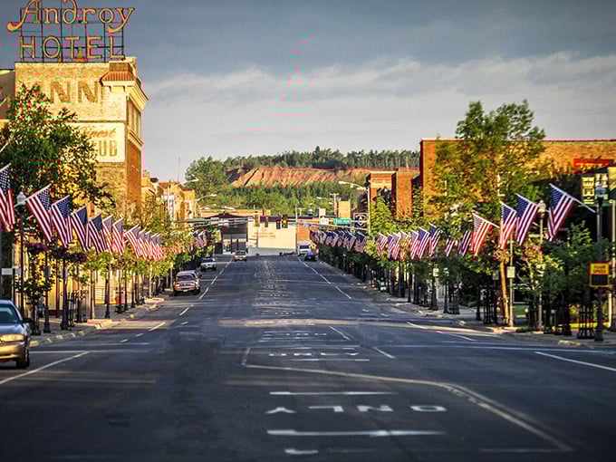 Howard Street comes alive with patriotic spirit, American flags lining the thoroughfare beneath the watchful presence of the iconic Androy Hotel.