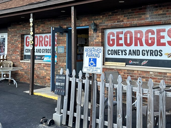 That white picket fence isn't just charming—it's practically a barrier holding back the crowds once word got out about these legendary gyros.