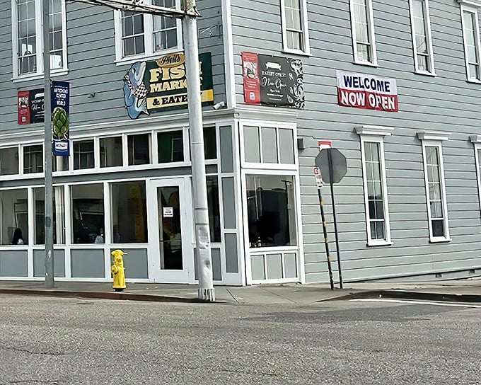 The unassuming exterior of Phil's Fish Market & Eatery belies the seafood treasures within. That cheerful blue fish sign has become a beacon for hungry travelers.