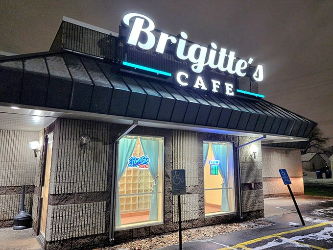 Even at night, Brigitte's glowing sign serves as a beacon for hungry travelers seeking refuge from the cold.