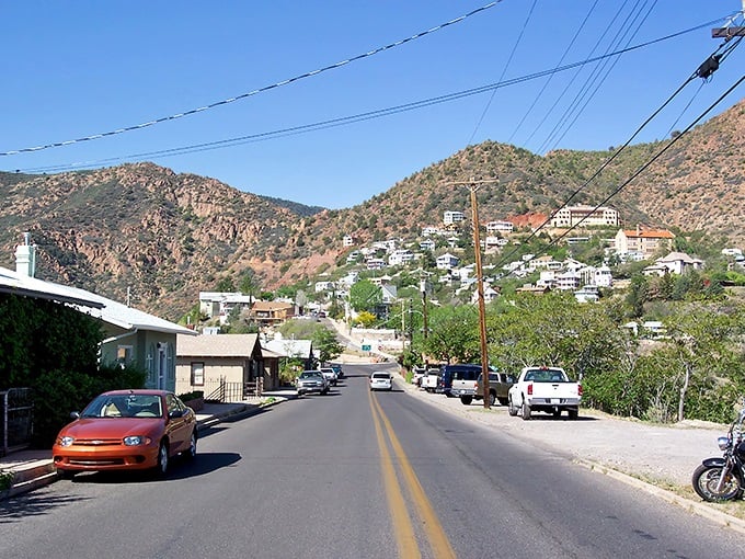 Jerome's winding roads and hillside homes create a living postcard, where every turn reveals another slice of Arizona history against rugged mountain backdrops.