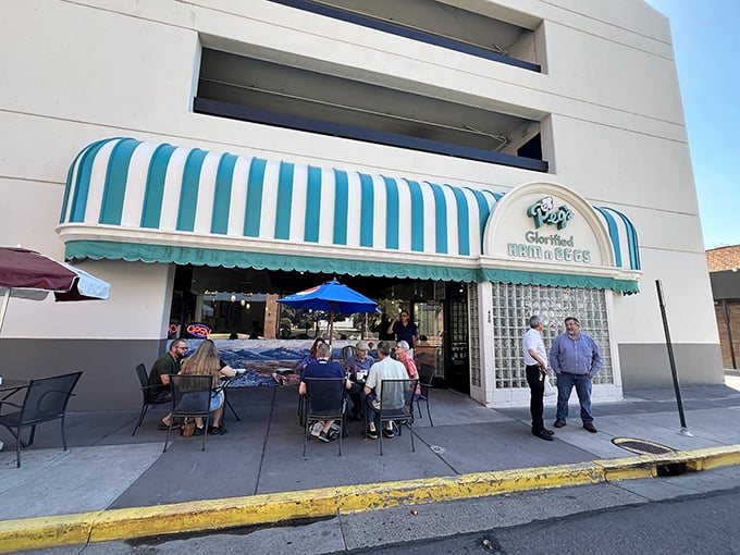 The iconic blue-and-white striped awning of Peg's stands out like a breakfast beacon, promising morning salvation to hungry Reno locals and visitors alike.