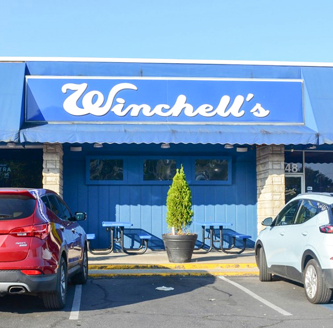 That iconic blue awning signals you've arrived at flavor paradise. Winchell's modest exterior on Southland Drive hides culinary treasures waiting to be discovered.
