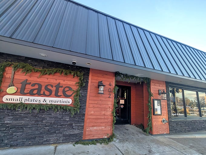The coral-hued exterior of Taste beckons like a culinary lighthouse on South Haven's shore, promising small plates and big flavors behind its unassuming facade.