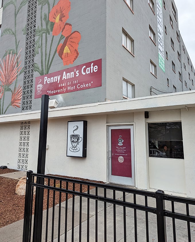The mural-adorned exterior of Penny Ann's proudly announces its signature "Heavenly Hot Cakes" – proof that culinary treasures often hide behind modest facades.