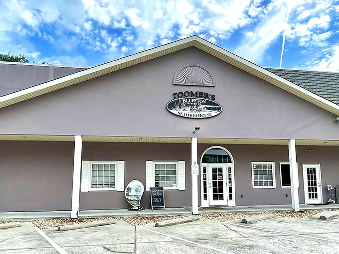 The unassuming exterior of Toomer's hides culinary treasures within, like finding a pearl in an oyster – no flashy neon needed when the seafood speaks for itself.