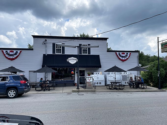 The white clapboard exterior with patriotic bunting isn't just charming—it's a time portal disguised as a general store. Small-town America at its sweetest.