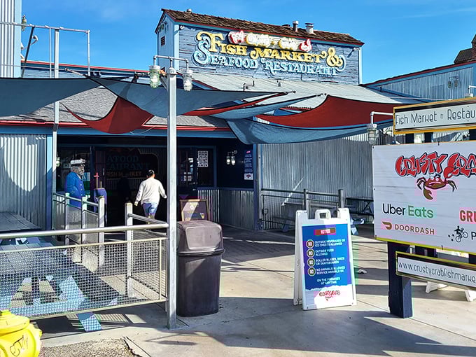 The weathered blue exterior of San Pedro Fish Market beckons seafood lovers like a maritime siren song, promising oceanic treasures within those corrugated metal walls.