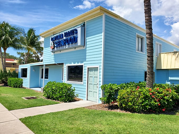 The cheerful blue exterior of Captain Eddie's stands out like a beacon for seafood lovers – Florida's answer to "if you build it, they will come."