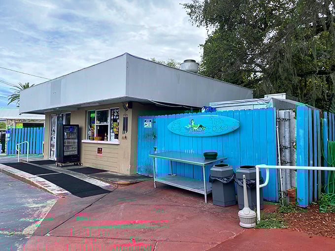 The bright blue fence at Uncle Chicken's isn't just eye-catching—it's nature's way of saying "extraordinary food happens here." No fancy frills, just flavor paradise waiting.