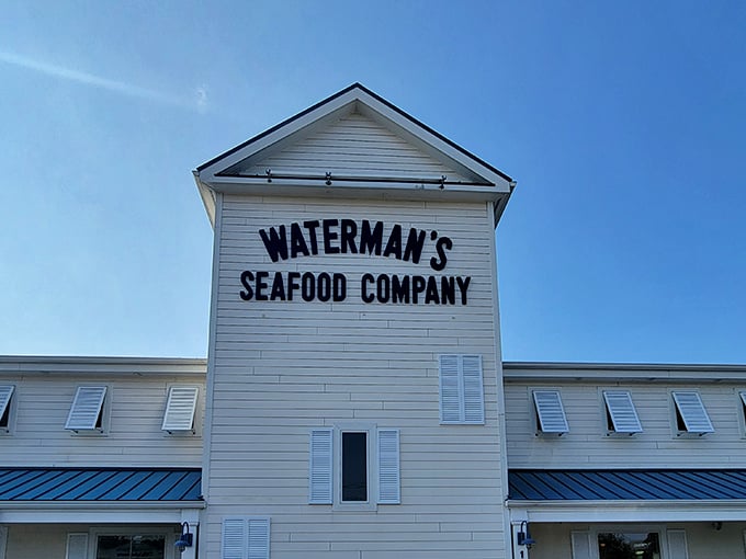 The white clapboard exterior of Waterman's stands proud against the blue sky, like a maritime flag signaling "Seafood Ahead!" to hungry Ocean City visitors.