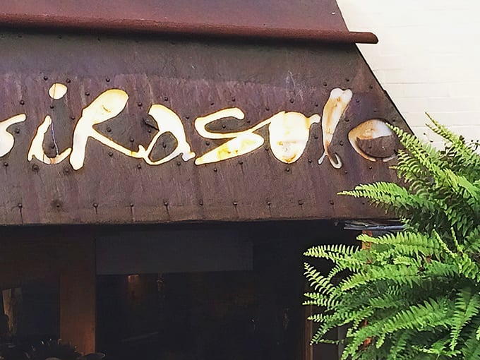 This golden-lit signage proves that sometimes the best treasures don't need to shout for attention.