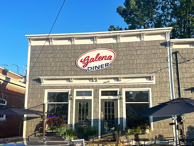 The stone facade of Galena Diner stands proudly against a blue Ohio sky, its classic red sign promising comfort food treasures within.