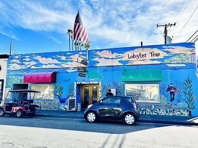 The Lobster Trap's vibrant blue exterior is like finding a mermaid's hideout on dry land. That American flag isn't just patriotic—it's signaling "seafood independence" from ordinary meals.