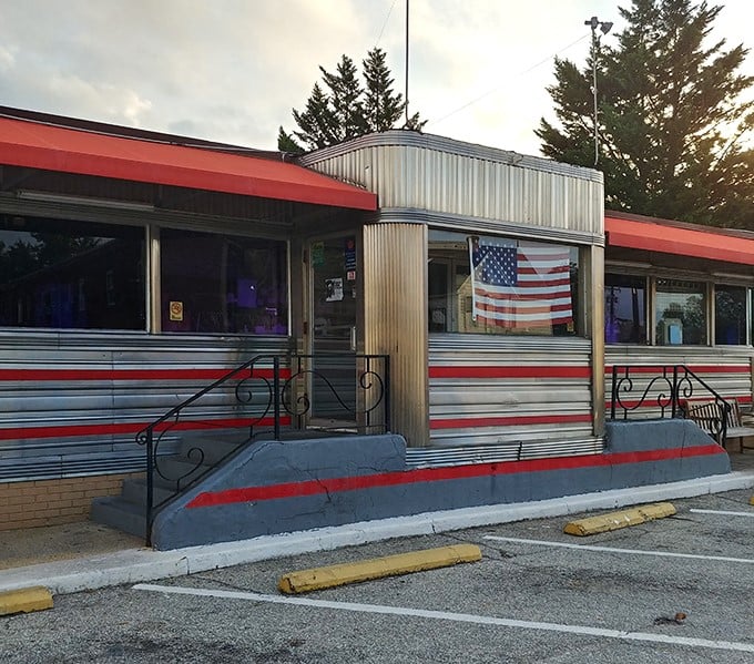 An American flag proudly displayed in the window welcomes patrons to this slice of Americana, where patriotism and pancakes have coexisted for generations.