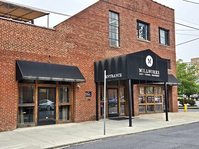 The brick facade of The Millworks stands as a testament to Harrisburg's industrial past, now transformed into a culinary playground for the present.