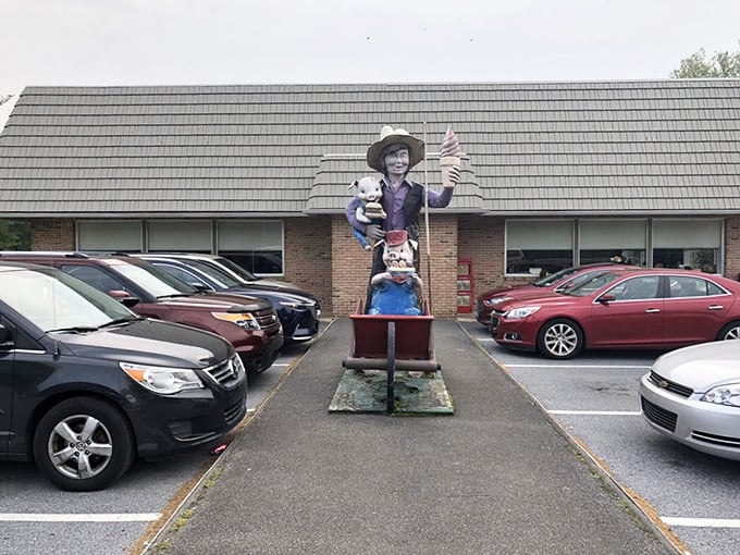 The welcoming committee at Katie's Kitchen includes this charming Amish figure, standing guard in the parking lot like a friendly sentinel promising good eats ahead.