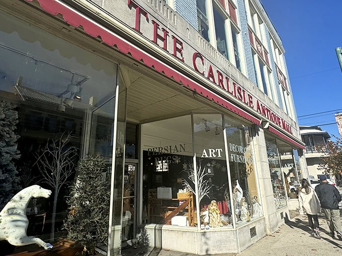 The iconic red awning of Carlisle Antique Mall beckons treasure hunters like a vintage siren song to downtown Carlisle's historic district.