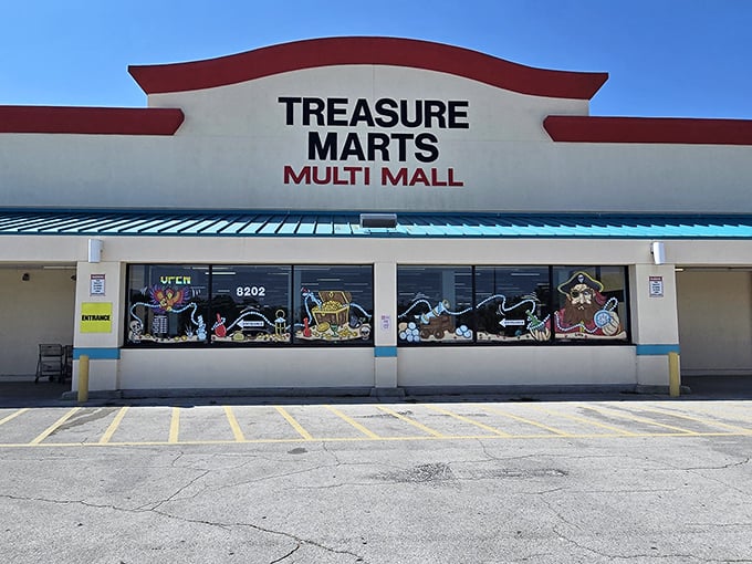 The iconic red-trimmed facade of Treasure Marts beckons bargain hunters like a siren call to the wallet-conscious adventurer.