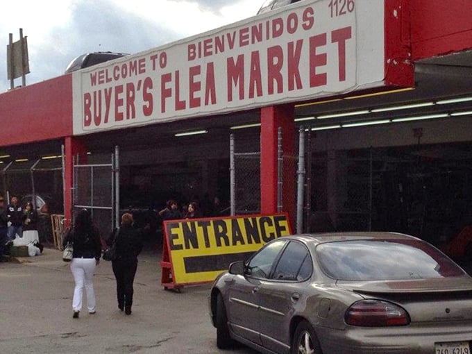 The iconic red and white entrance sign welcomes bargain hunters with bilingual hospitality. Like the pearly gates of retail paradise, but with better prices.