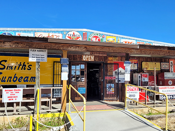 The entrance beckons with nostalgic charm – vintage Texaco signs and weathered advertisements promise treasures waiting just beyond those doors.