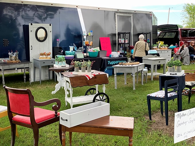 Furniture finds that tell stories—shabby chic tables, vintage chairs, and planters arranged like a living room under the open sky.