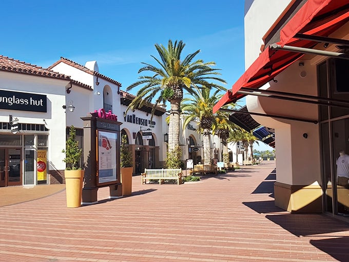 Palm trees and Spanish-style architecture create a shopping paradise that feels more like a Mediterranean resort than a bargain hunter's playground.