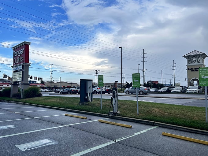 Welcome to shopping paradise! Tanger Outlets' iconic entrance beckons with coastal-inspired architecture and the promise of retail therapy just minutes from the beach.