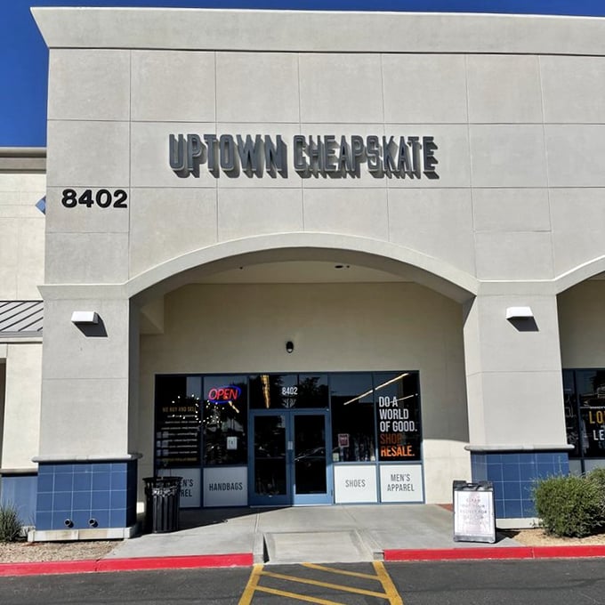 The desert sun bounces off Uptown Cheapskate's clean facade, promising air-conditioned treasure hunting within. Fashion salvation awaits behind those doors!