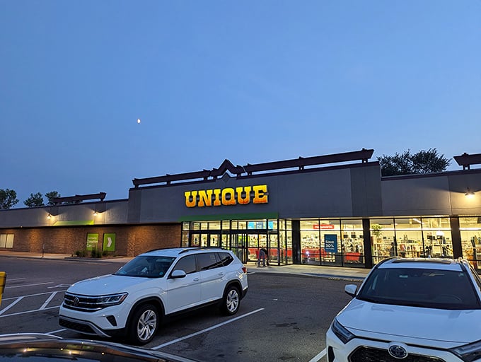 Unique's exterior glows like a beacon of thrifty hope against the twilight sky, promising treasures within that won't break the bank.