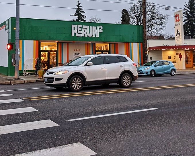RERUN's vibrant green exterior with rainbow stripes isn't just eye-catching—it's a preview of the colorful treasures waiting inside this Portland secondhand paradise.