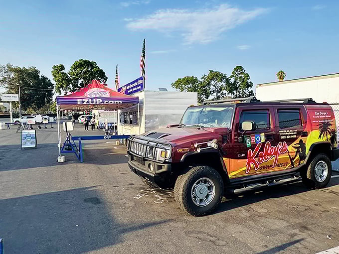 The official Kobey's Hummer – part vehicle, part mobile billboard – stands guard at the entrance like a carnival barker with four-wheel drive.