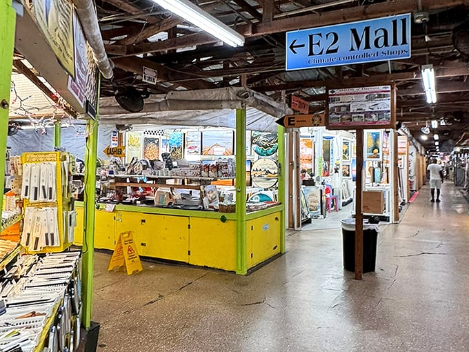 The E2 Mall corridor beckons with its bright yellow booths and endless possibilities—like a treasure map where X marks every spot.