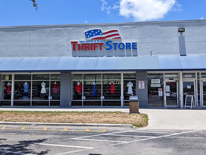 The patriotic facade of Red White & Blue Thrift Store promises treasure hunting adventures that would make Indiana Jones trade his whip for a shopping cart.