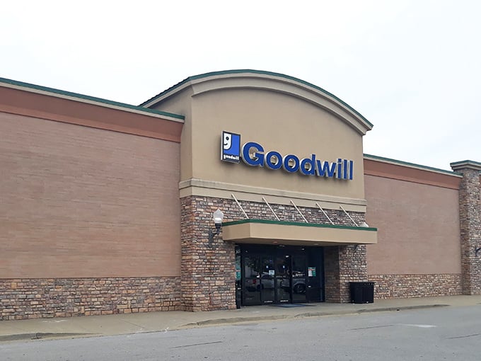 The iconic blue Goodwill sign beckons like a lighthouse for bargain hunters navigating the sea of retail sameness in Nicholasville.