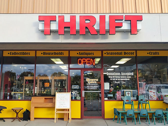 The bright red "THRIFT" sign beckons like a lighthouse for bargain hunters. Yellow awnings below proudly announce the treasure categories awaiting inside.