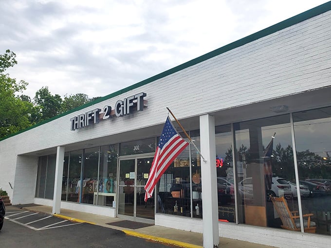 American flags flutter beside the entrance, a patriotic welcome to this bargain hunter's paradise where yesterday's castoffs become tomorrow's treasures.