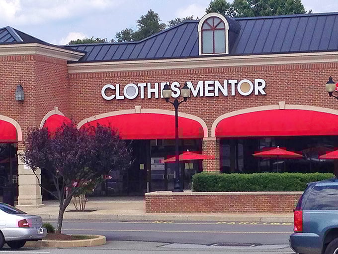 The brick storefront with its cheerful pink awnings promises fashion treasures within—like a beacon for style-seekers on a budget.
