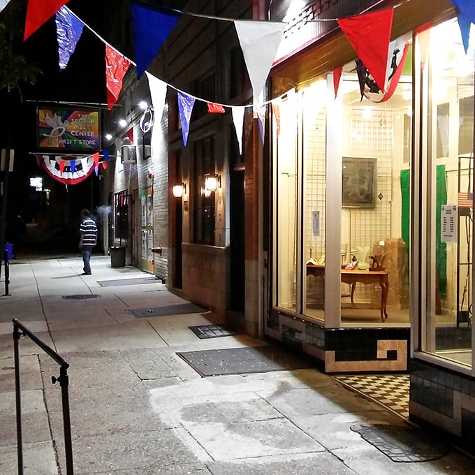 The colorful pennant flags outside The Second Mile Center create a carnival atmosphere, beckoning bargain hunters into this Philadelphia thrifting paradise.