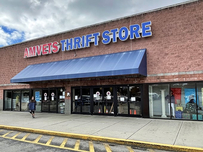 The iconic red and blue AMVETS sign stands like a beacon of bargain hope against the Tennessee sky, promising treasures within.