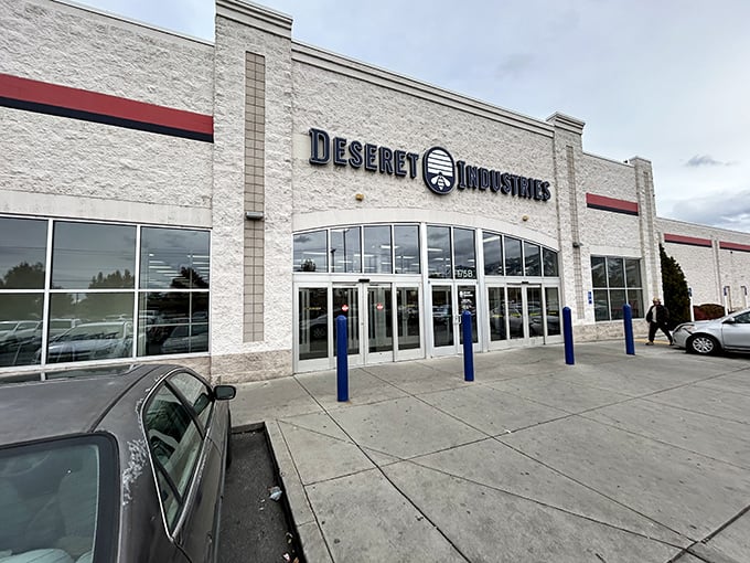 The modern facade of Deseret Industries in Logan beckons with the promise of treasures waiting inside—retail archaeology at its finest.