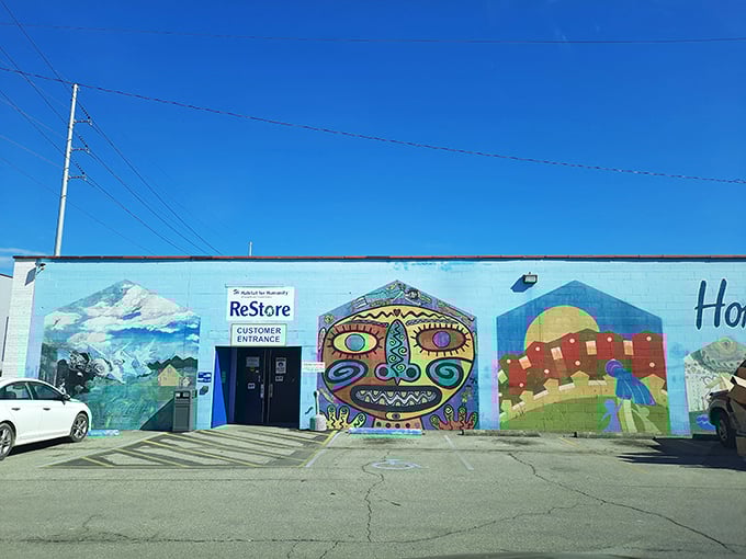 The vibrant mural-adorned exterior of Charleston's ReStore isn't just eye-catching—it's your first clue that treasure hunting awaits inside.