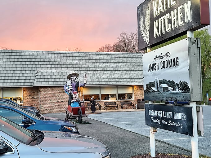 Katie's Kitchen glows at sunset, its sign promising "Authentic Amish Cooking" – a beacon for hungry travelers in Ronks, Pennsylvania.