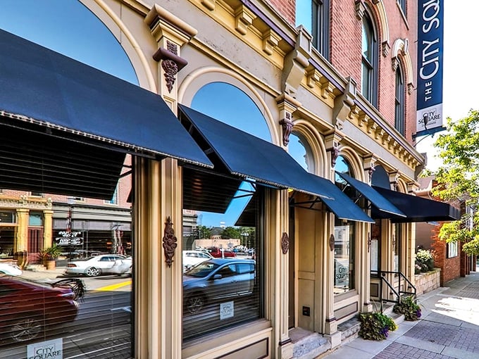 The historic façade of City Square Steakhouse stands proudly on Wooster's square, its elegant arches and black awnings promising culinary sophistication within.