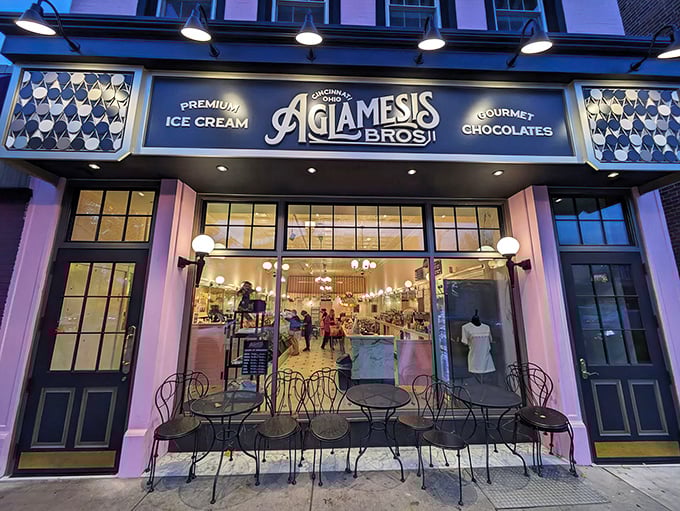 The pink palace of Oakley beckons with its vintage charm. Aglamesis Bros' distinctive façade promises sweet treasures within, standing proudly against the Cincinnati sky.