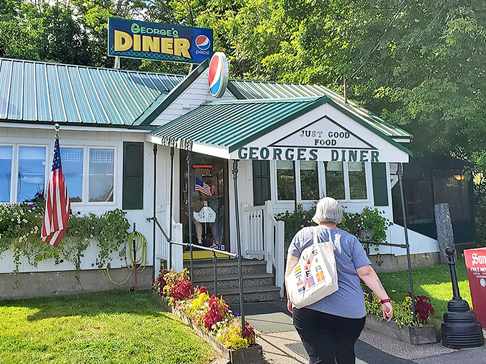 The quintessential New Hampshire diner experience awaits behind that green-trimmed facade. "JUST GOOD FOOD" isn't just a slogan—it's a solemn promise.