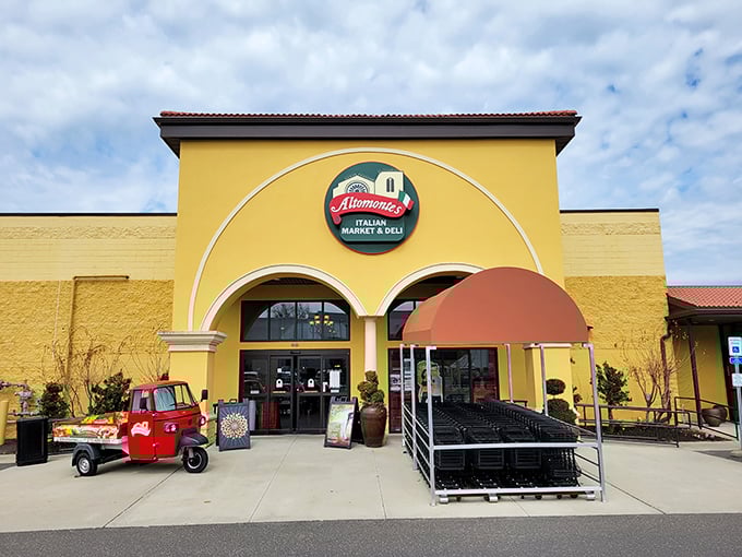 The sunshine-yellow façade of Altomonte's beckons like an Italian vacation postcard come to life. That little red Ape truck? Pure charm on wheels.