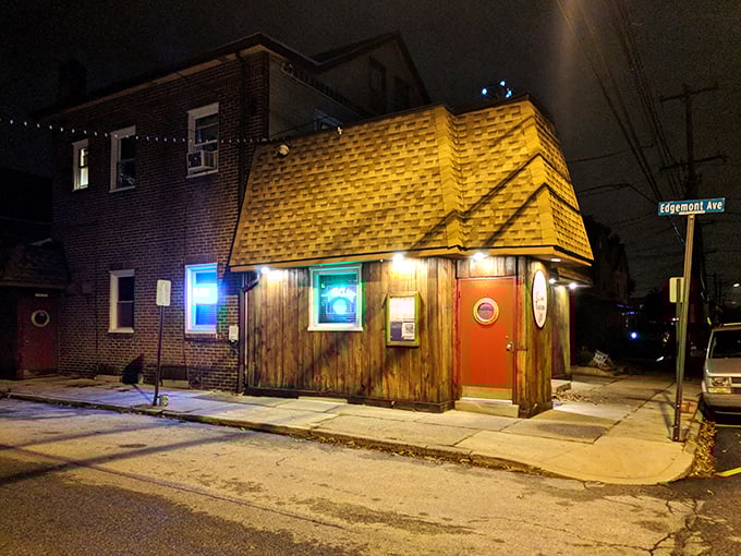 The unassuming exterior of Clam Tavern stands like a culinary speakeasy on Edgemont Avenue, its red door a portal to seafood nirvana.