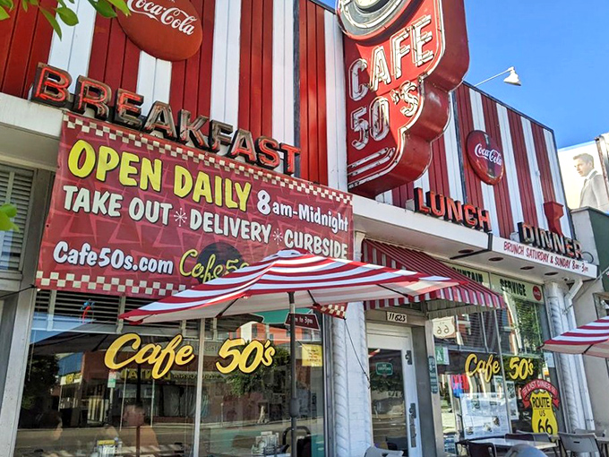 The red and white striped facade of Cafe 50's isn't just eye-catching—it's a time machine disguised as architecture. Nostalgia never looked so delicious.